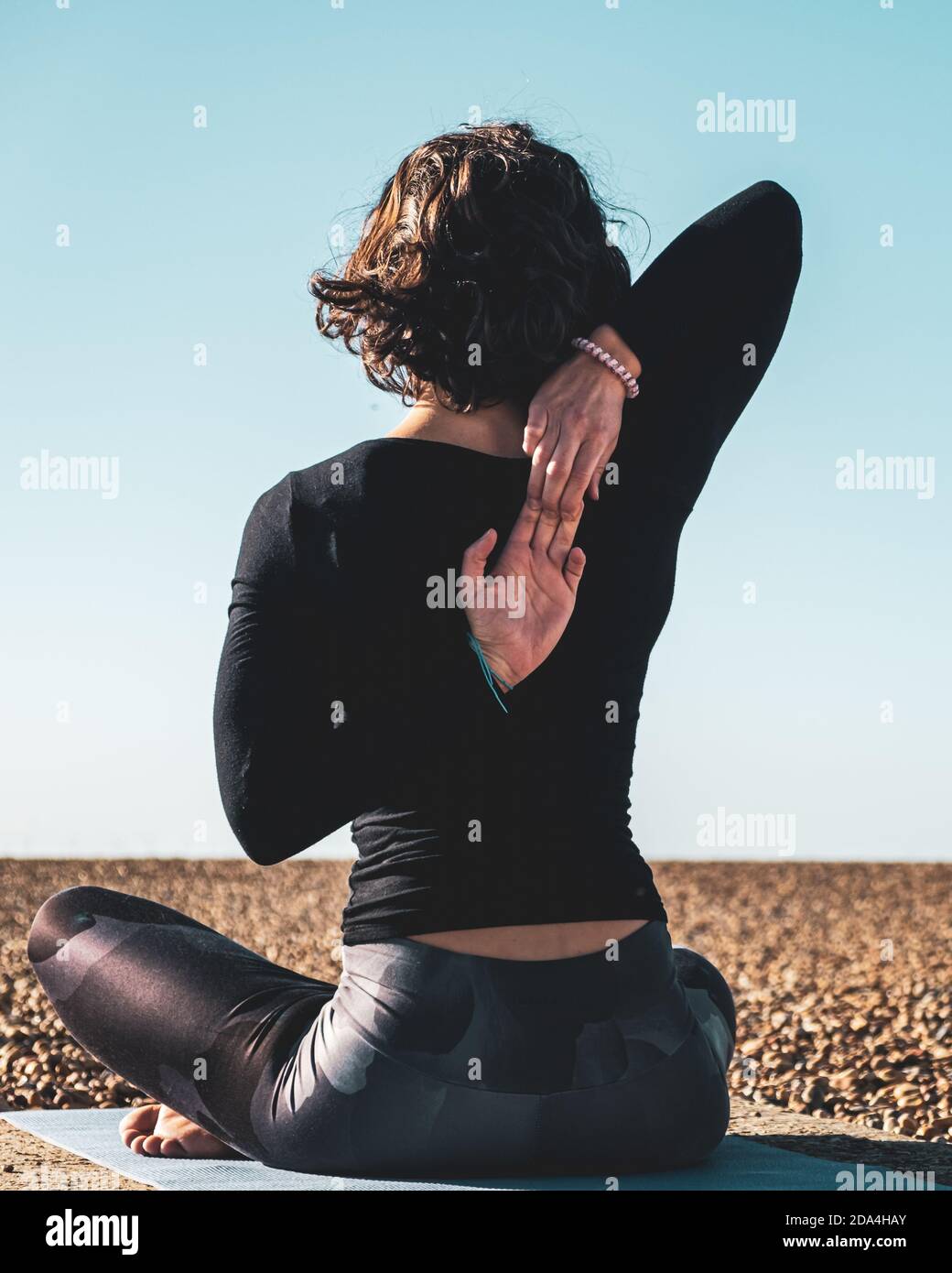 Yoga and mindfulness on the beach Stock Photo - Alamy