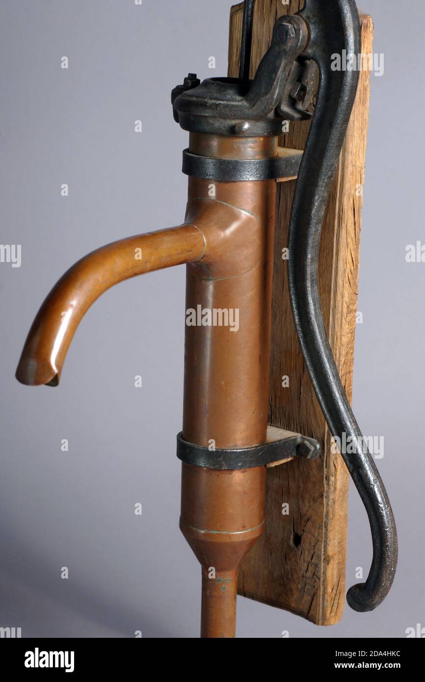 Antique manual plunger pump in copper and cast iron for water Stock ...