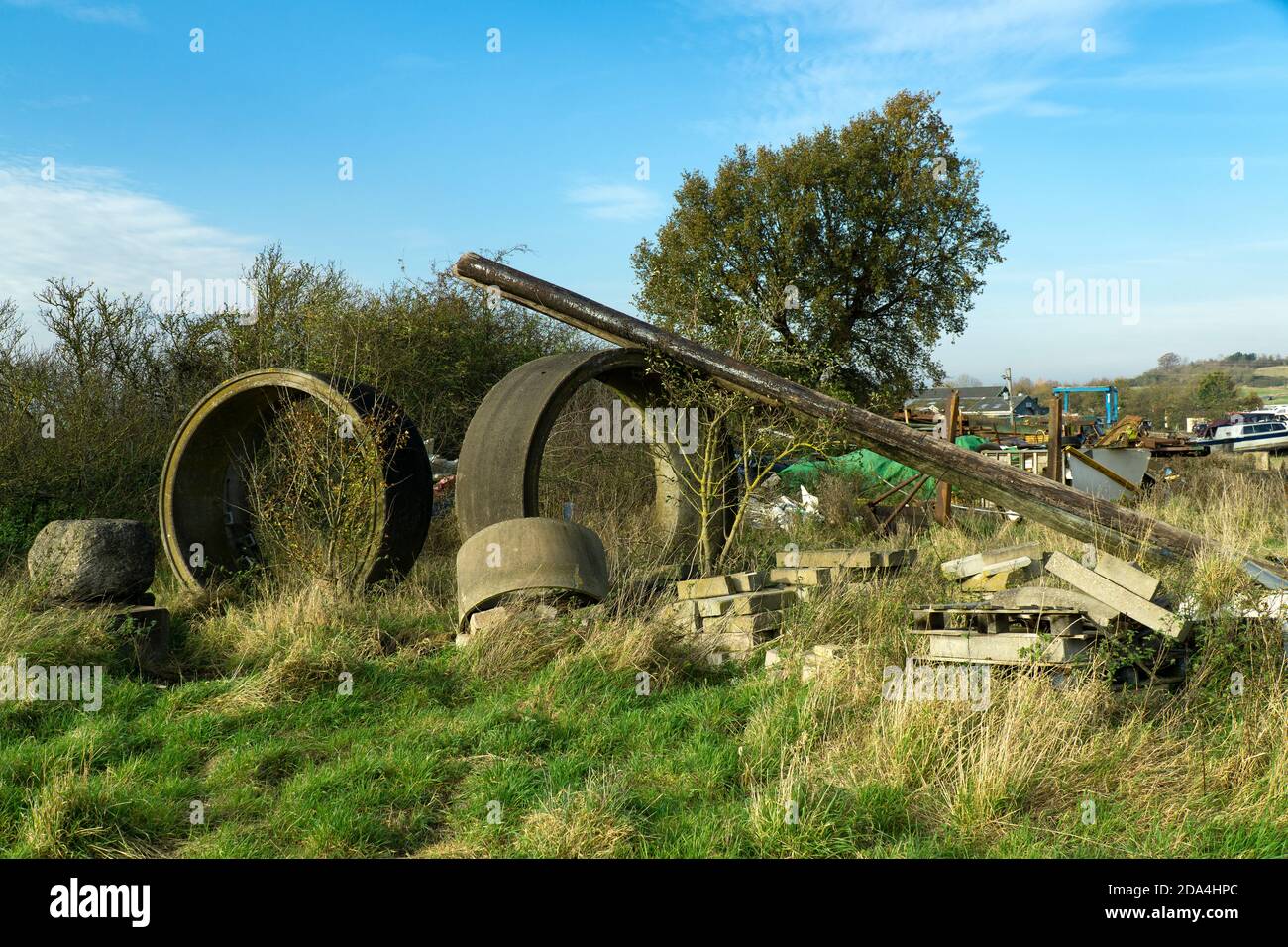 Large concrete sewer pipes in a junk yard Stock Photo - Alamy
