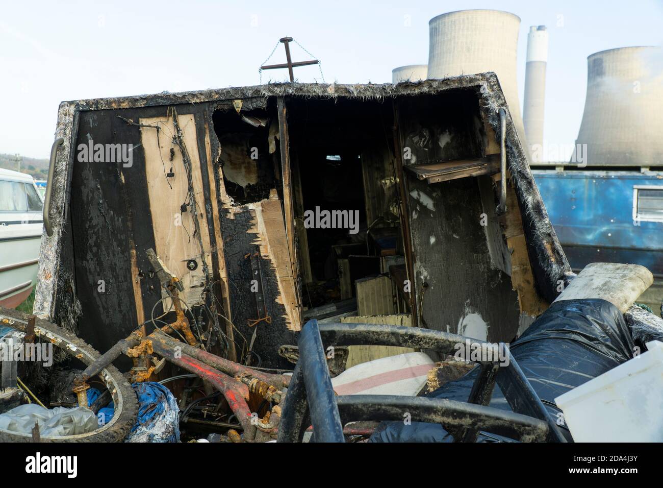 Burnt out hull of a small boat Stock Photo - Alamy