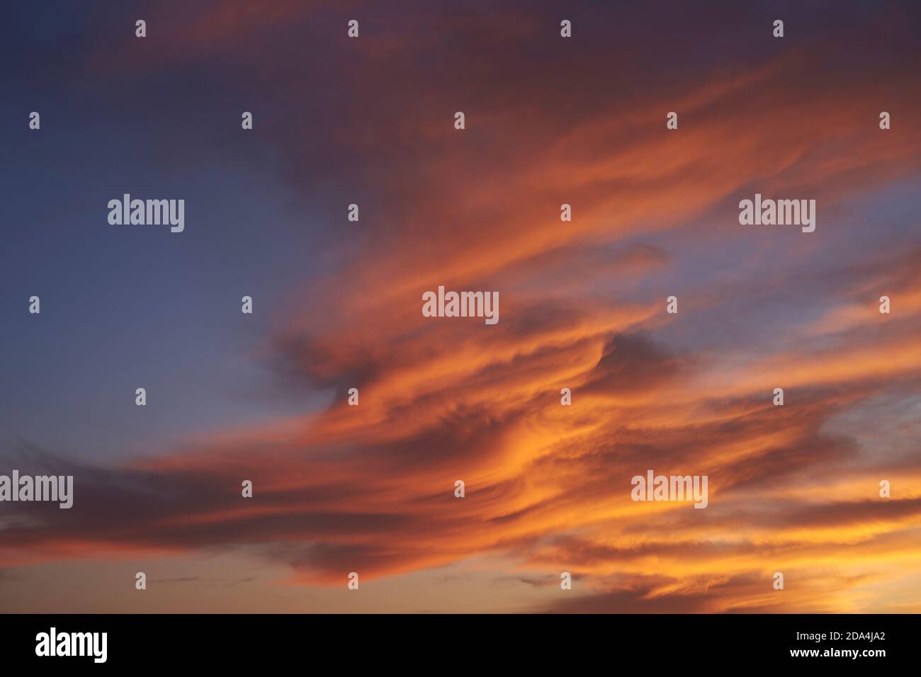 Sunset. Heaven, orange sky. Sun rays. Wallpaper. Clouds Stock Photo - Alamy