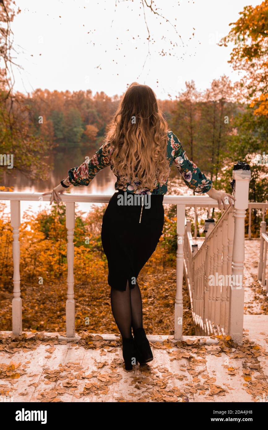 Beautiful woman leaning against railing hi-res stock photography and ...