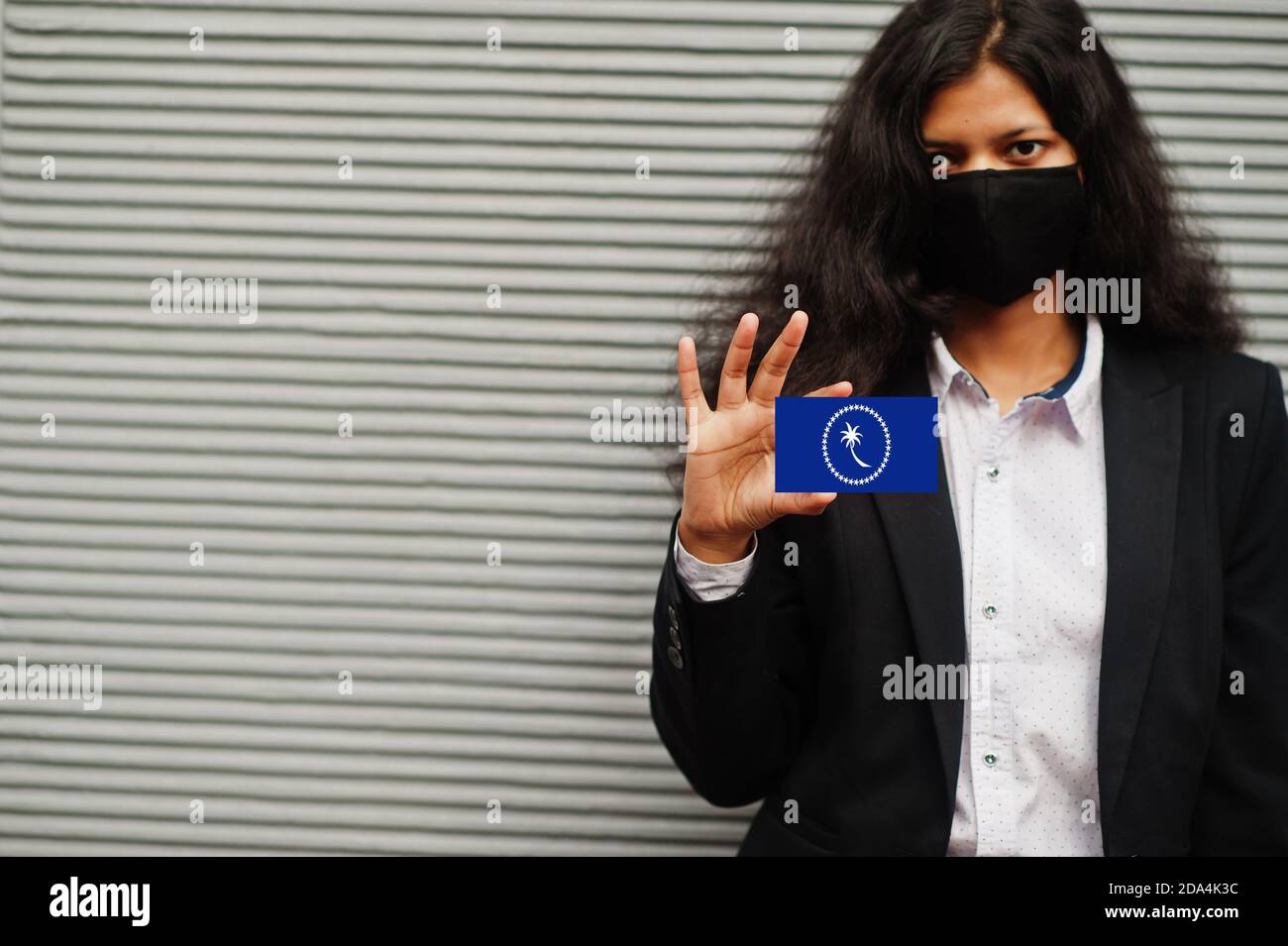 Asian woman at formal wear and black protect face mask hold Chuuk State ...
