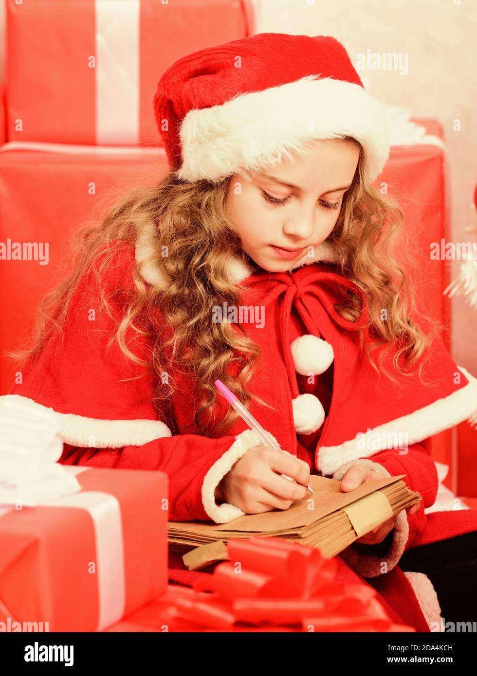 Wish list. I was good girl all year. Girl little kid hold pen and paper ...