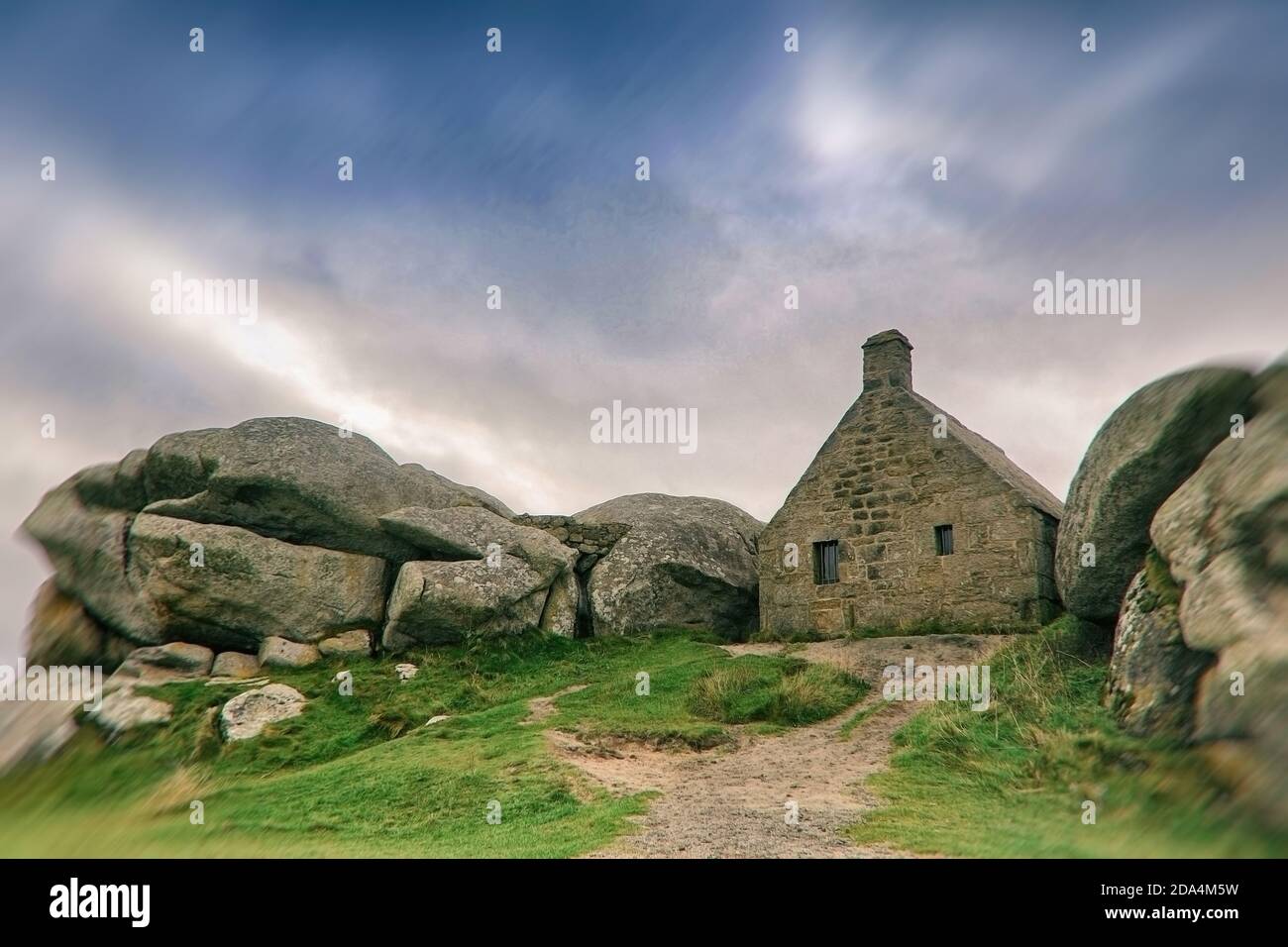 rustic house built between rocks, brittany Stock Photo - Alamy