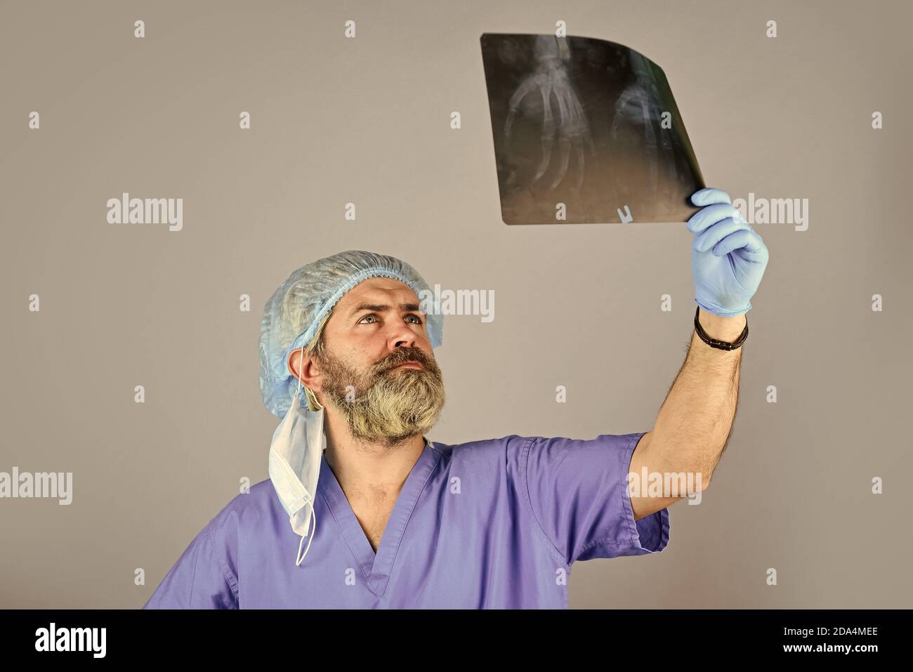 doctor examines radiographical snapshot. x-raying of hands. nurse ...