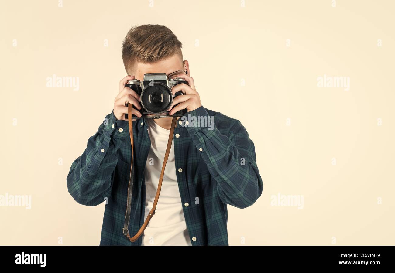 teen guy with retro photo camera. young talented photographer. faculty ...