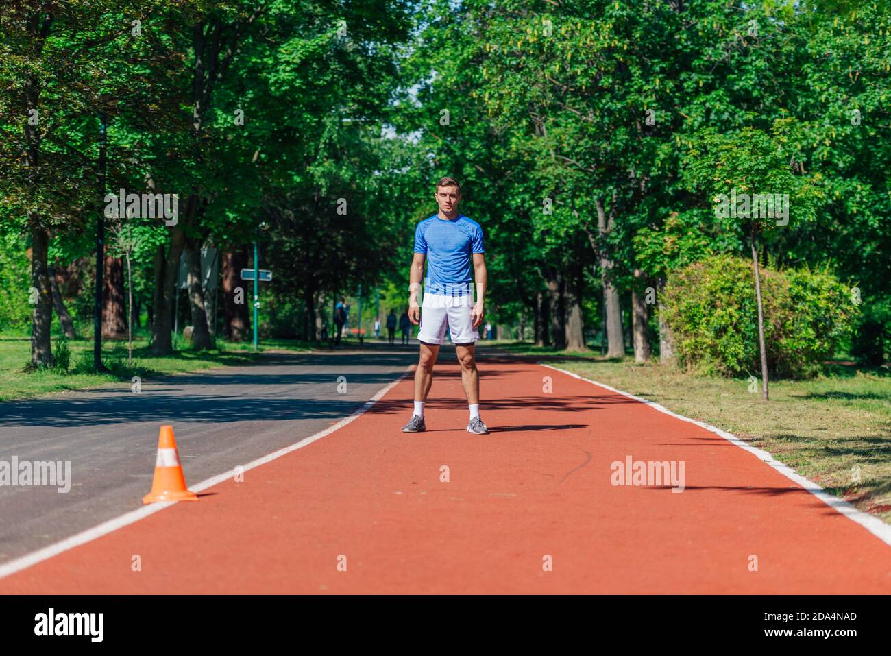 Confident man running in forest hi-res stock photography and images - Alamy