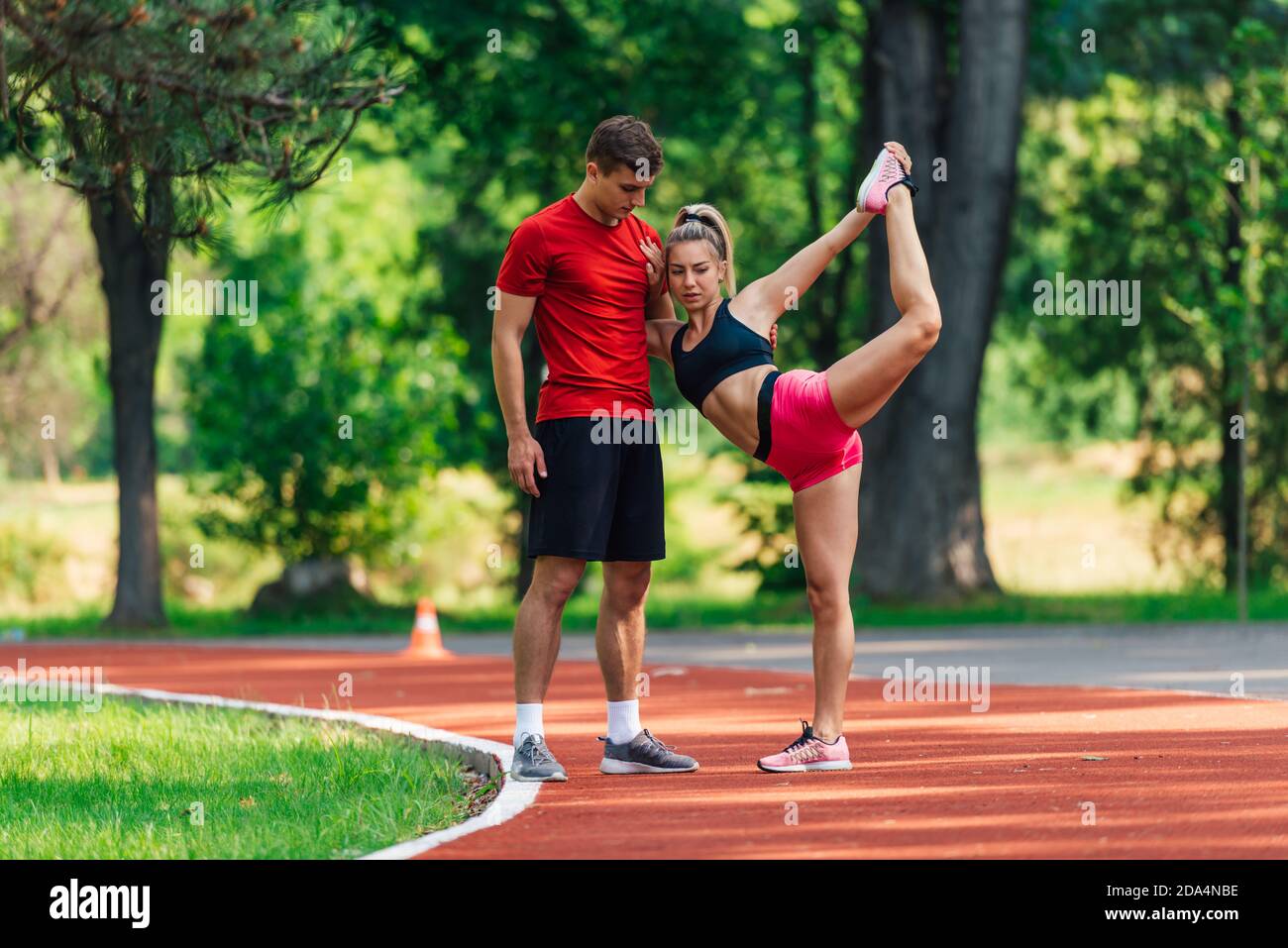 Man woman stretching legs after hi-res stock photography and images - Alamy