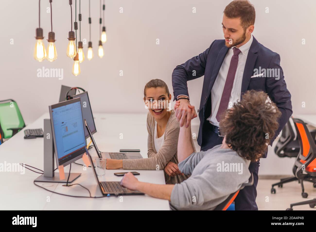 Manager overseeing his employees beautiful blonde and a coworker with ...