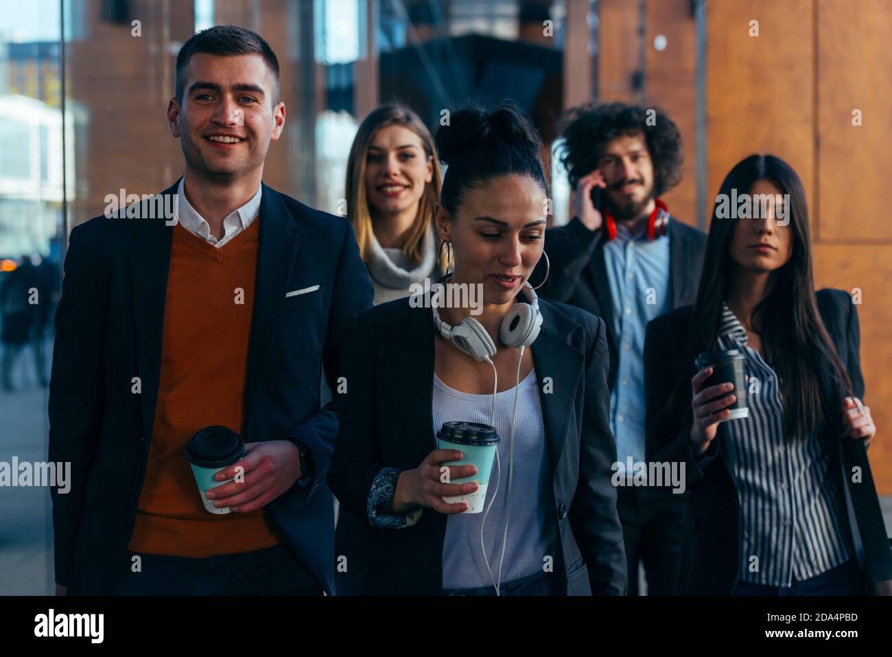 Group of colleagues on a business trip (euro trip) walking together at ...