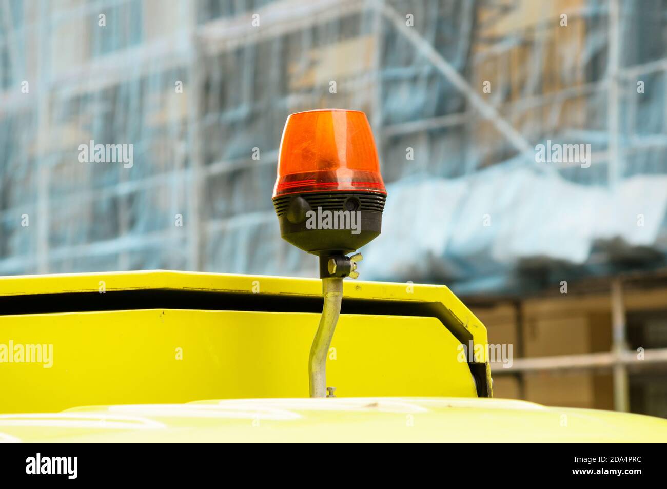 Orange siren in a yellow ambulance Stock Photo - Alamy