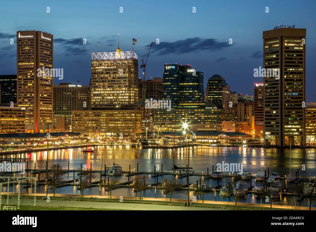 Baltimore Skyline at twilight and boats in marina, Inner Harbor ...