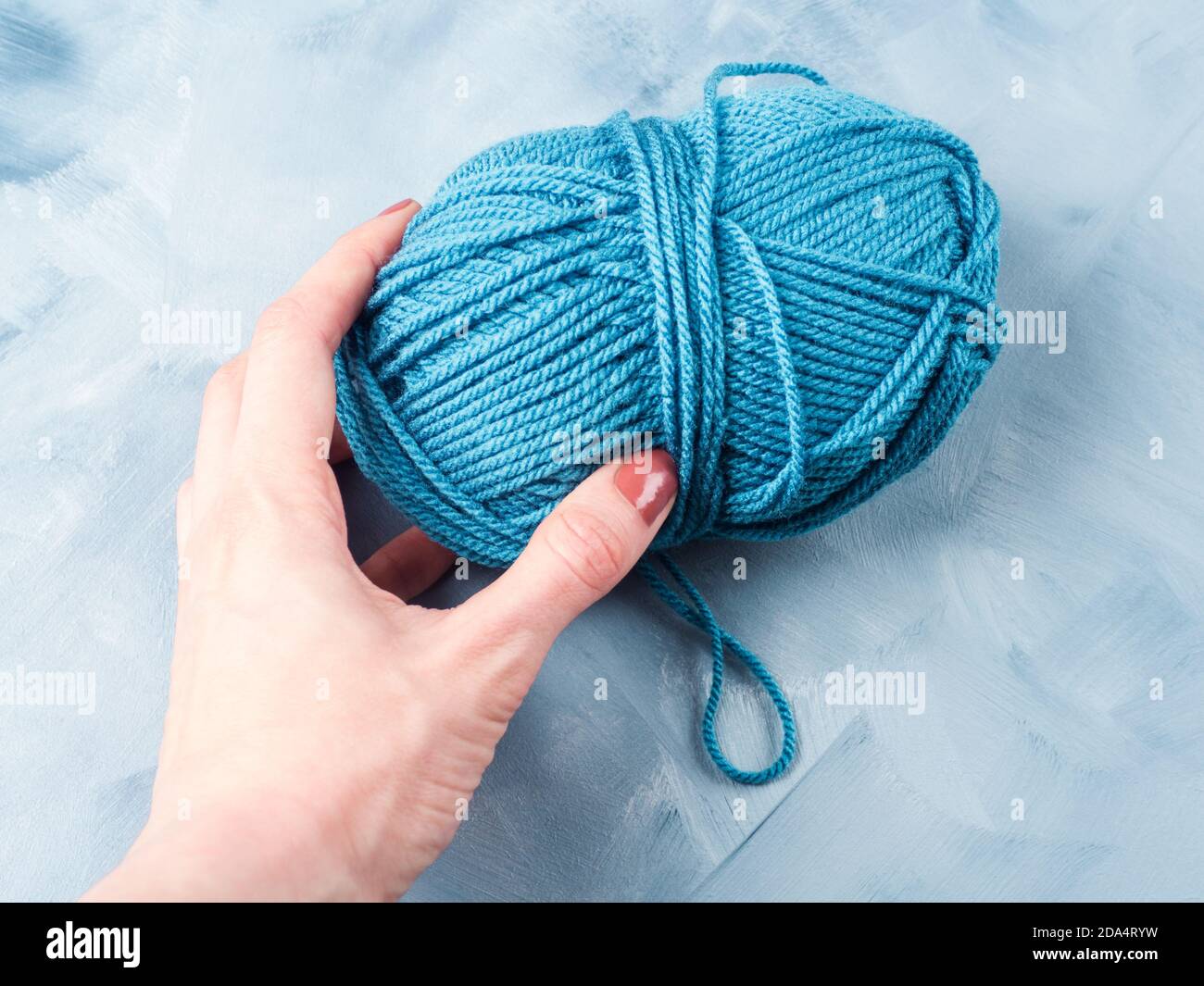 Woman knitting and blue hi-res stock photography and images - Alamy