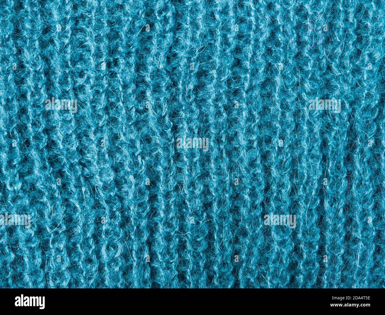 Blue wool knitted sweater texture background Stock Photo - Alamy