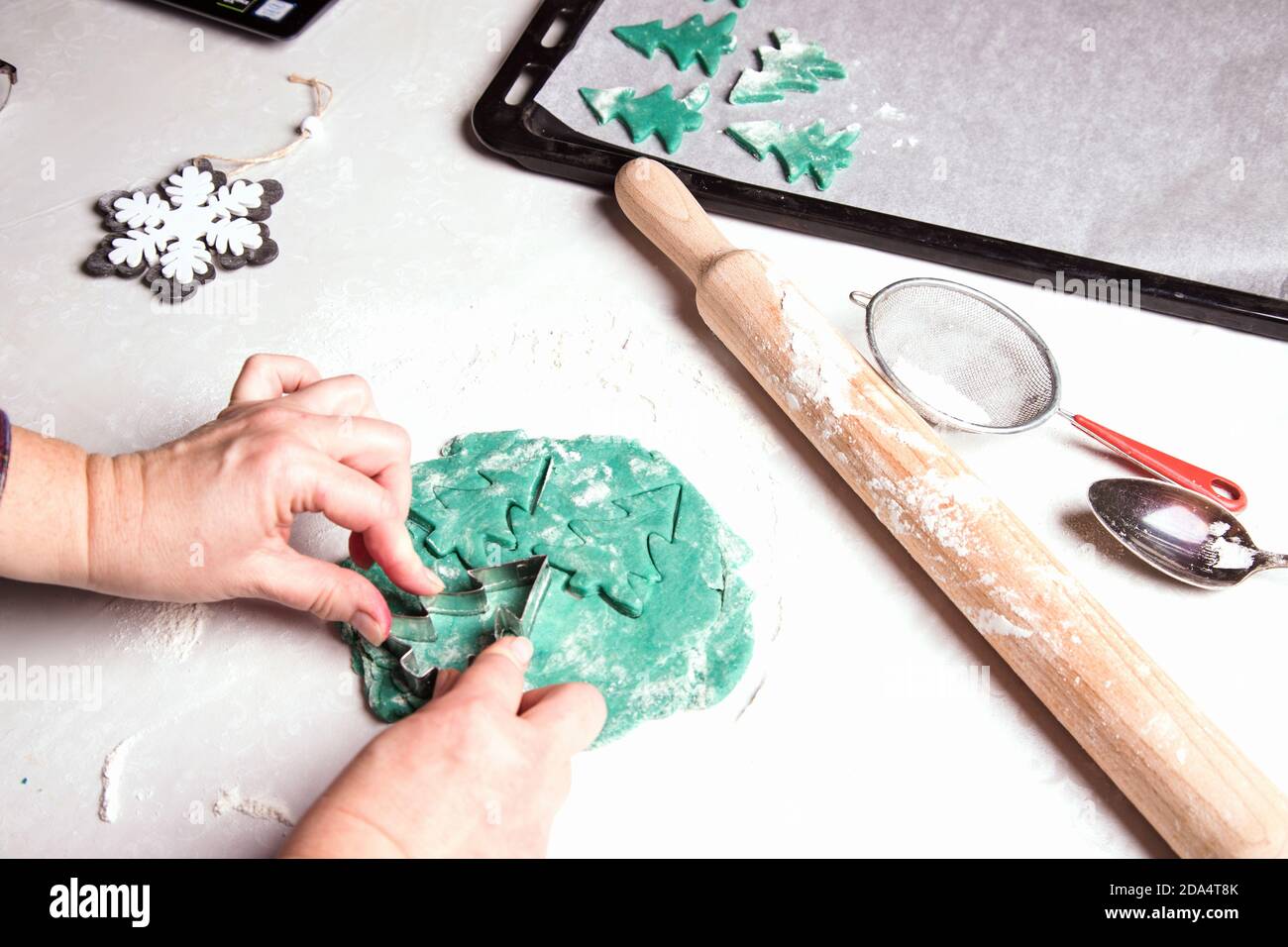 Home cooking of Christmas gingerbread. Women's hands make gingerbread ...