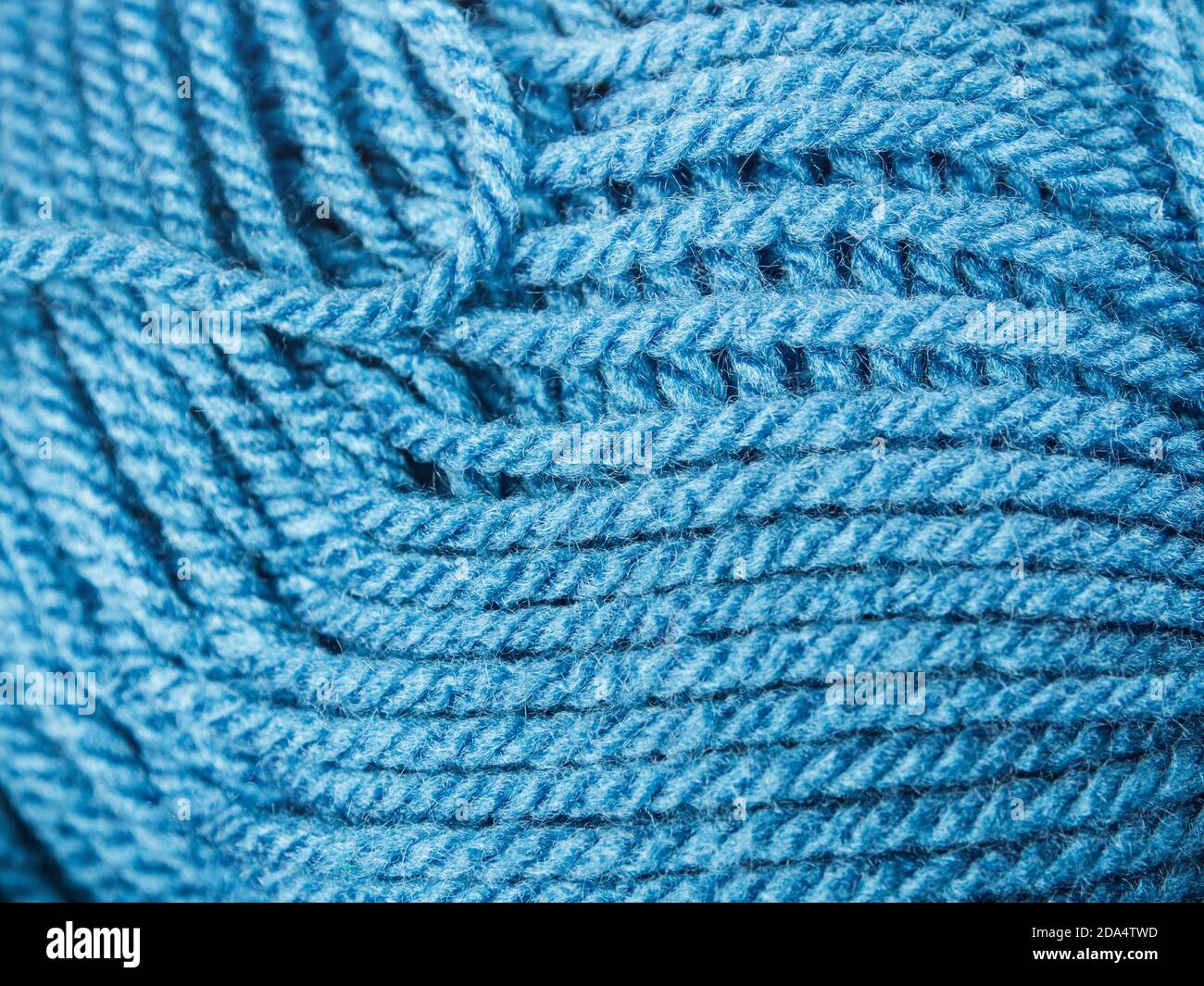 Blue wool knitting yarn texture background Stock Photo - Alamy