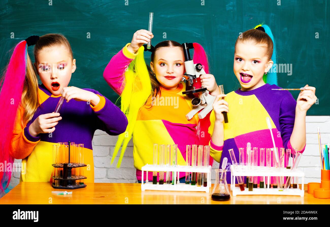 Fun and easy Science. Young scientists doing a chemical experiment in ...