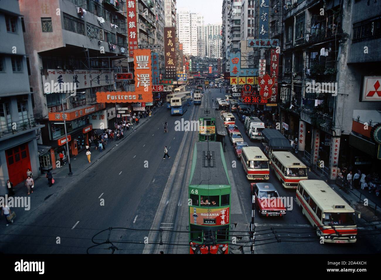 Main street Hong Kong Island with trams and buses 80s Stock Photo - Alamy