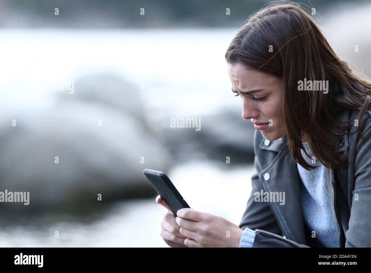 Depressed teenager female phone hi-res stock photography and images - Alamy