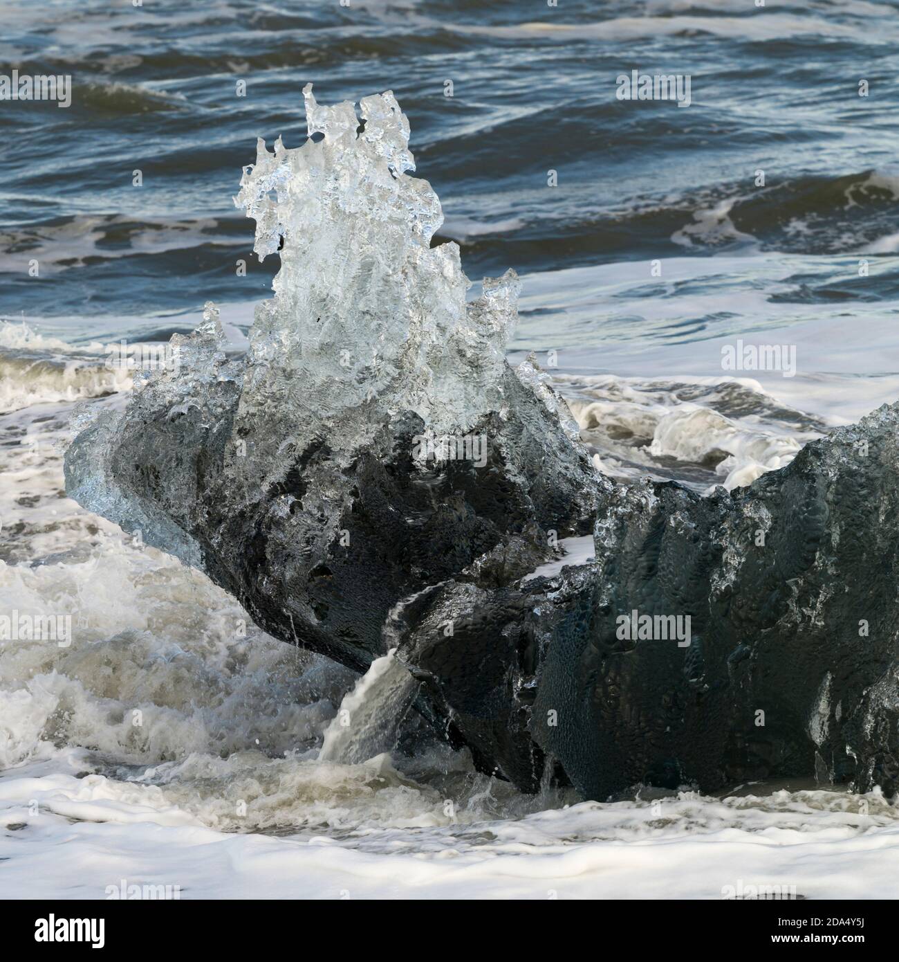 Iceberg being splashed at Diamond Beach, Hornafjorour, Eastern Region ...