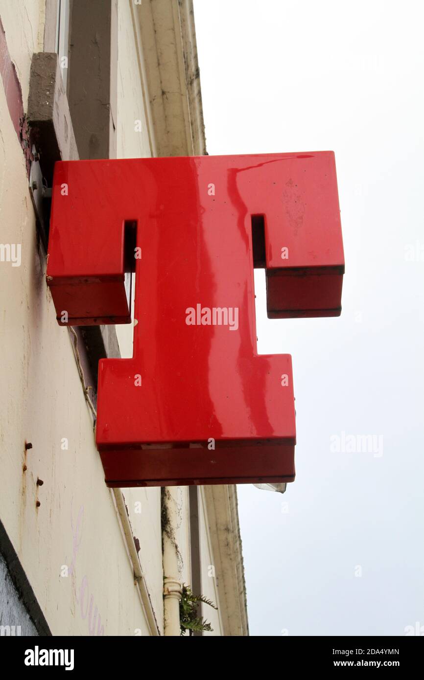 Alphabet Letters. A large Red T which is the brand of Tennants Lager ...