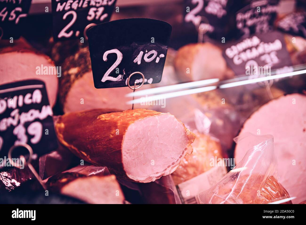 Ham and other processed meats on display Stock Photo - Alamy