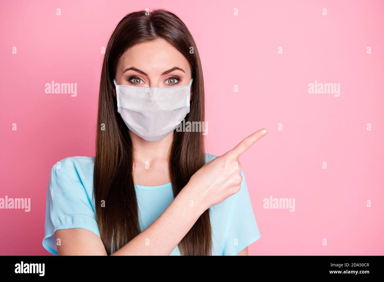 Portrait of positive girl point index finger copyspace wear white face ...