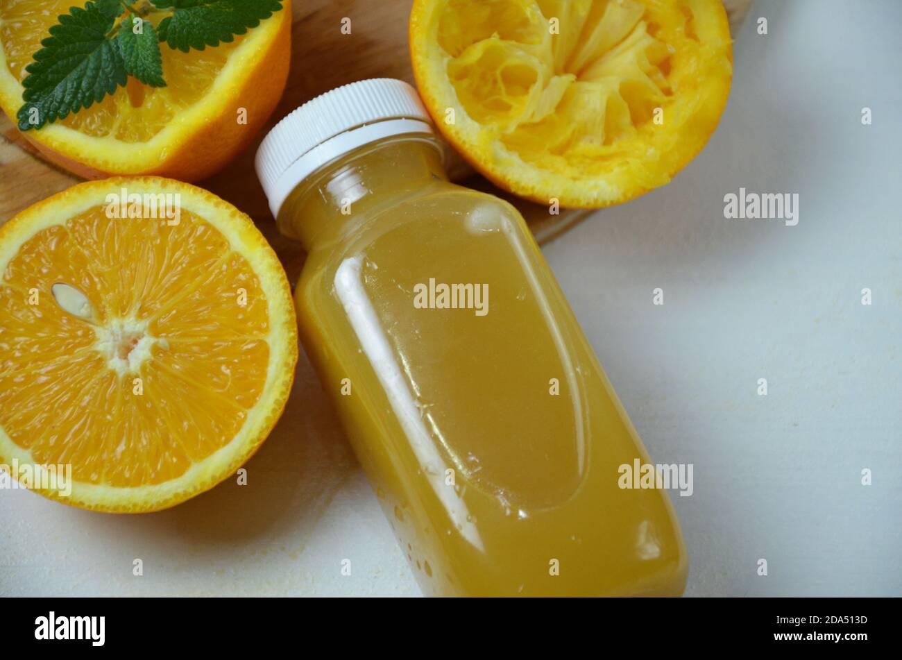 Bottle of orange juice shot. orange organic freshly squeezed juice in a ...