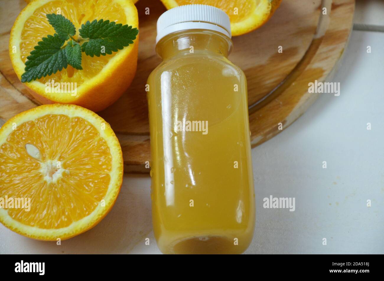 Bottle of orange juice shot. orange organic freshly squeezed juice in a ...