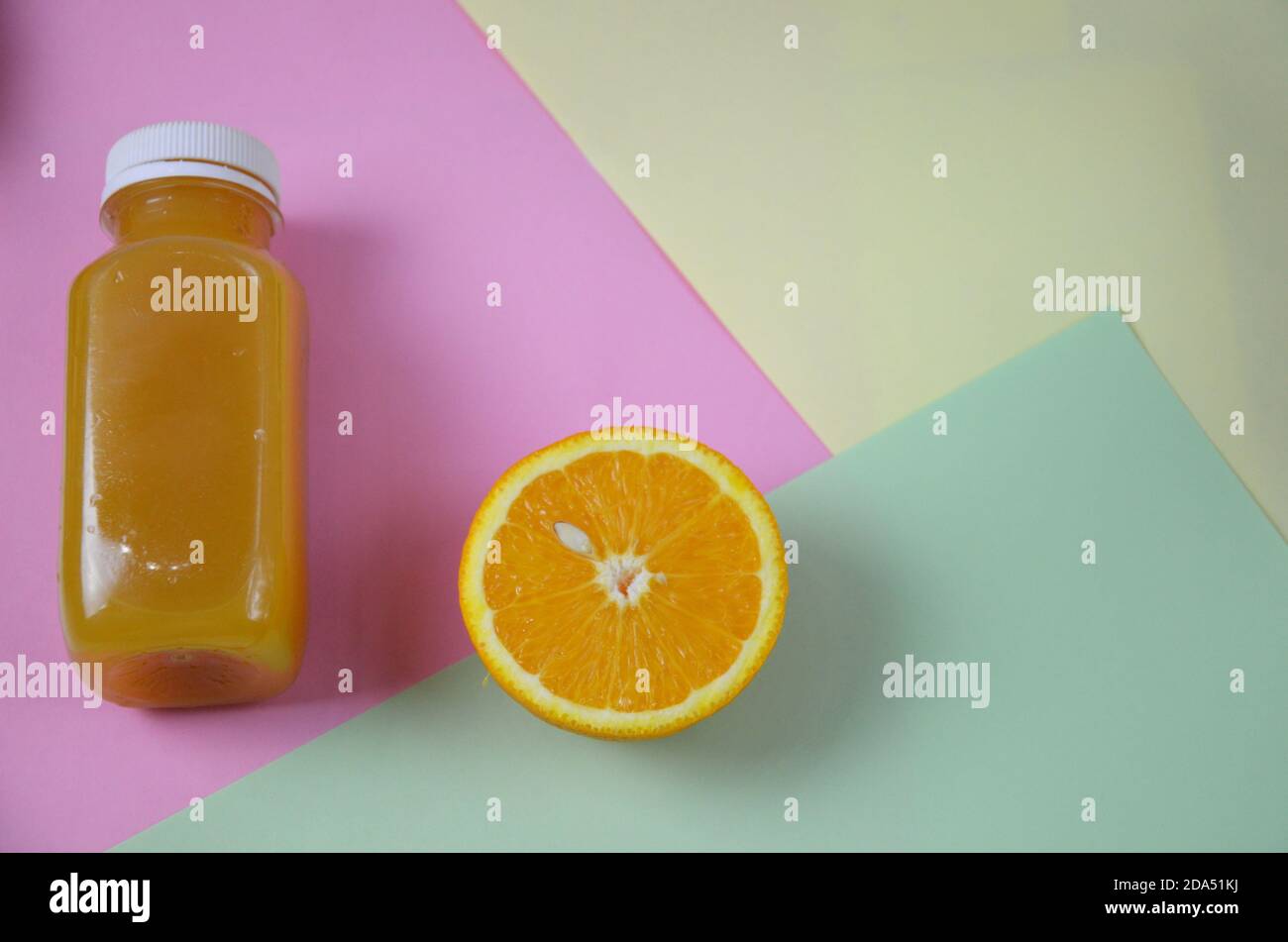 Bottle of orange juice shot. orange organic freshly squeezed juice in a ...