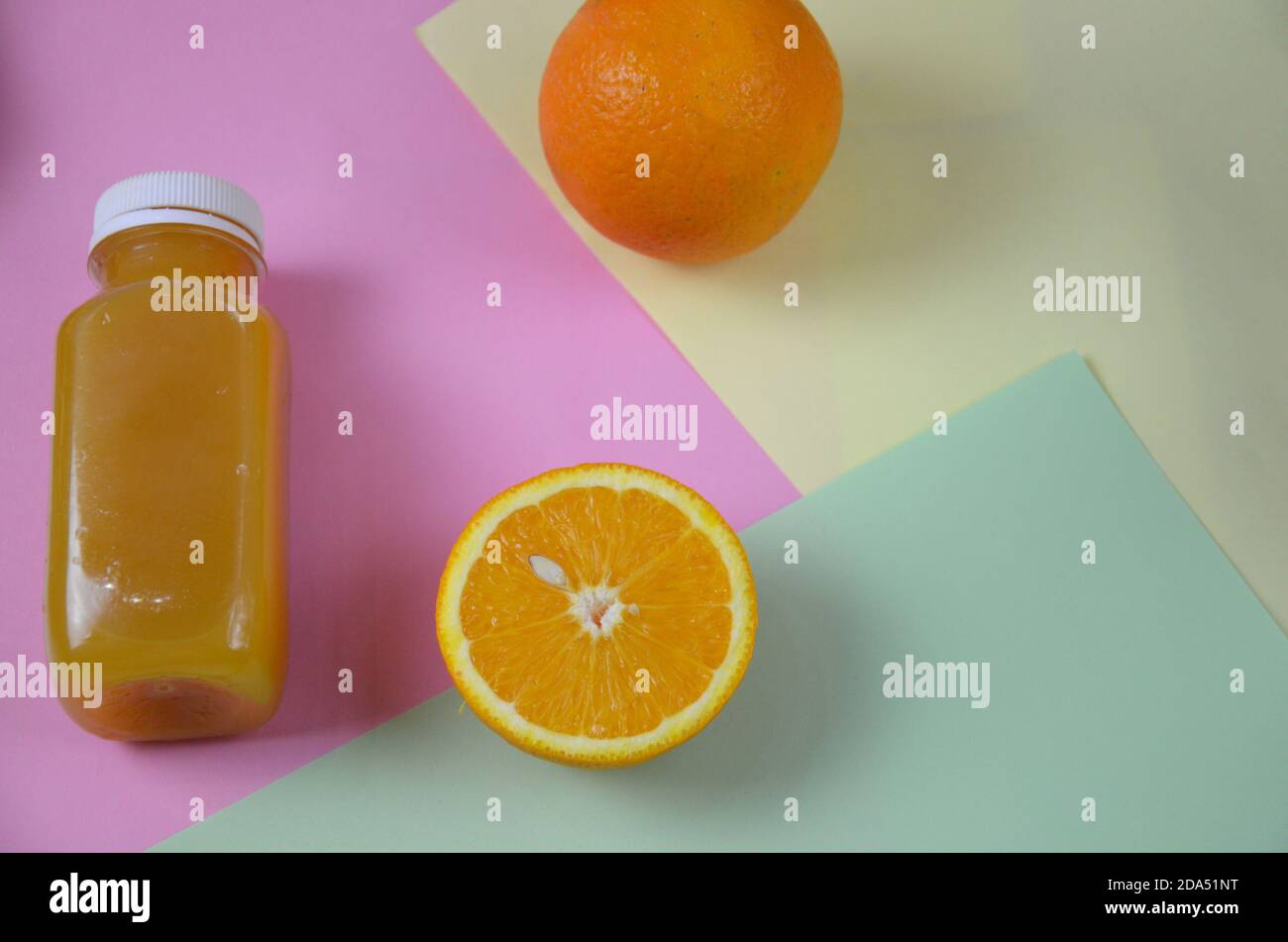 Bottle of orange juice shot. orange organic freshly squeezed juice in a ...