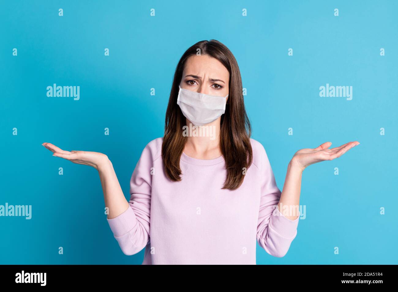 Photo of sad lady shrug shoulders crying wear white face mask isolated ...