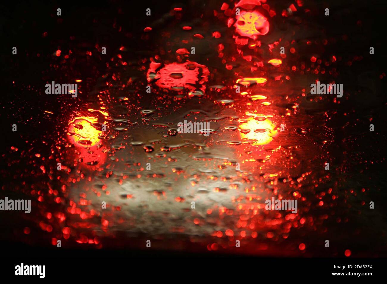 Red water droplets on car Stock Photo - Alamy