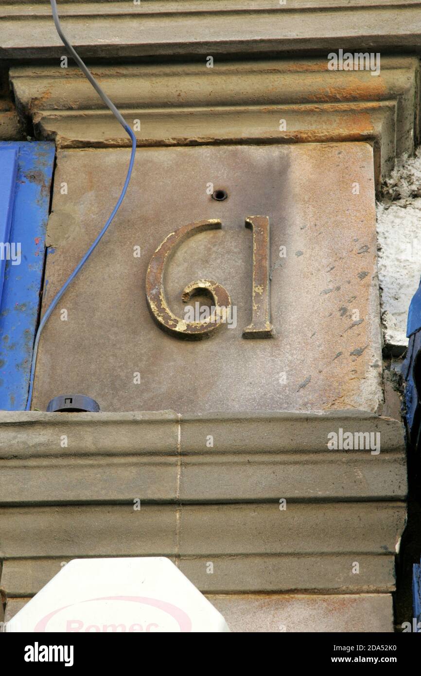 Number, various, on wall, clocks, signs , advertising , vehicles. Worn ...