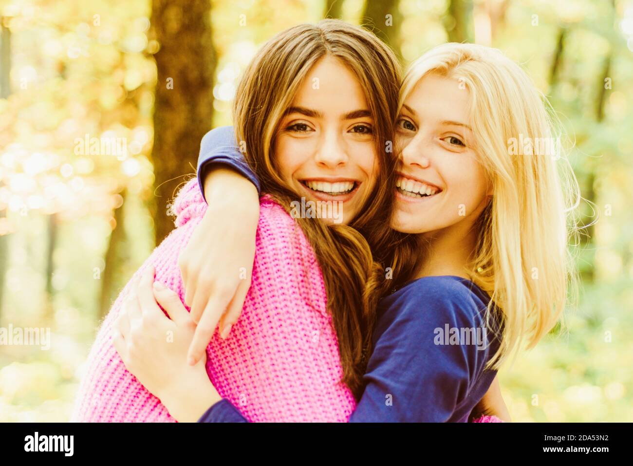 Happy friends vacation. Two happy friends laughing and smiling outdoors ...