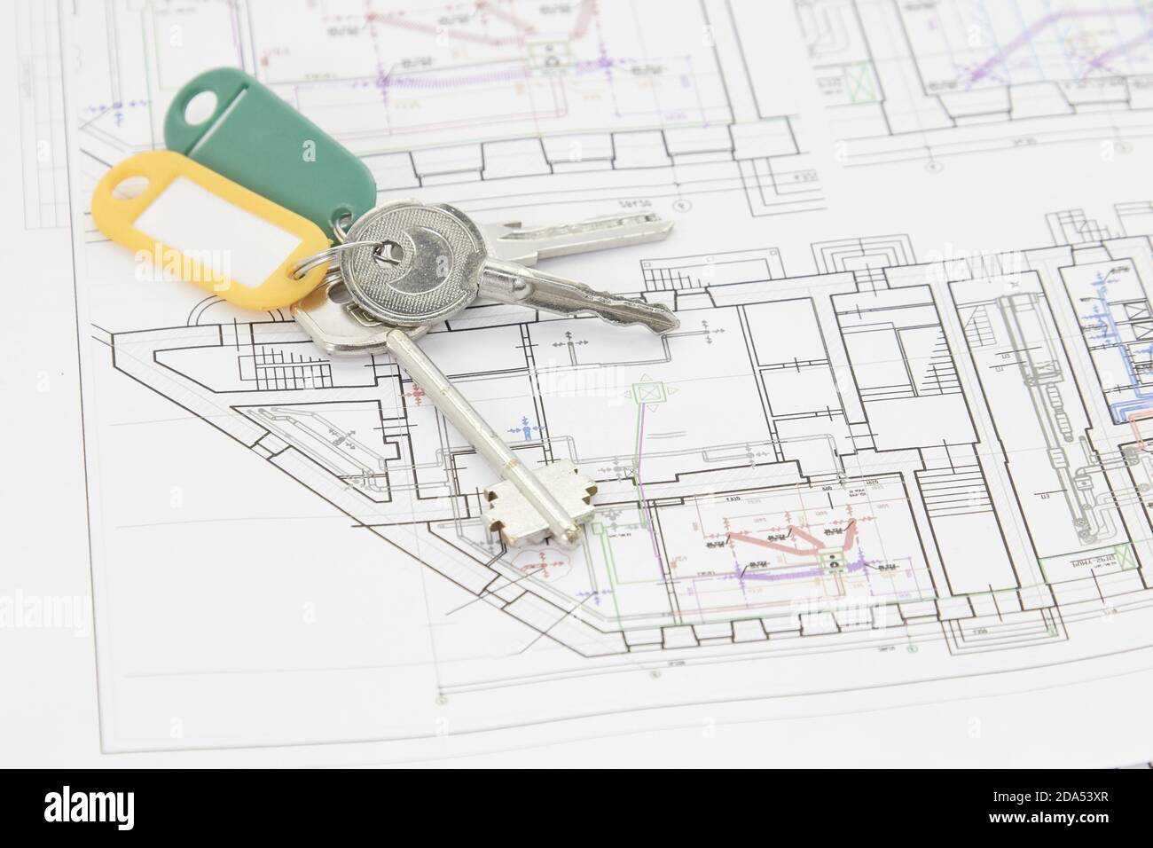 architectural drawings on a white sheet with keys to the house, the ...