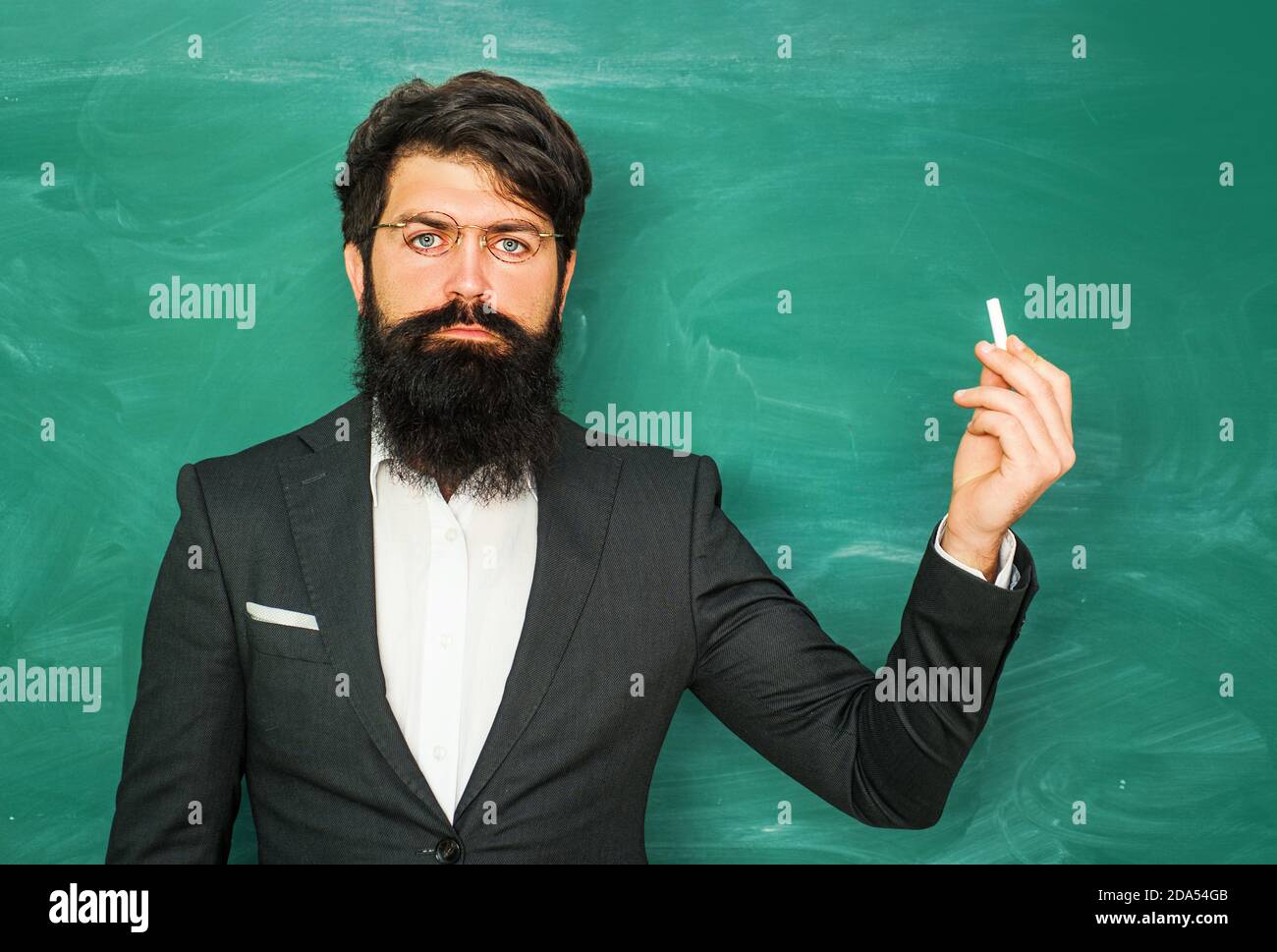 Good teachers enjoy teaching. Bearded professor at school lesson at ...