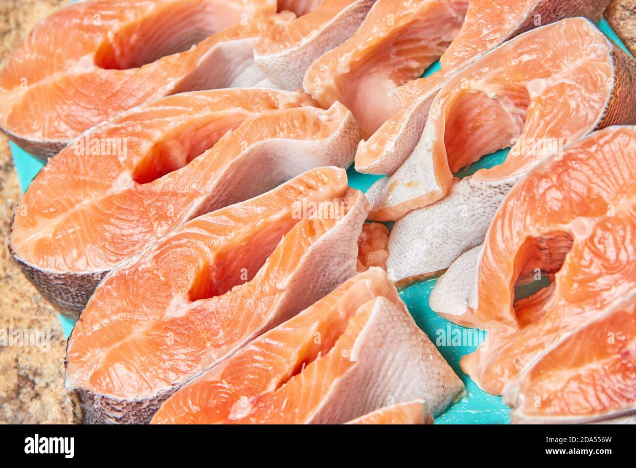 French fresh fish cut and spread on cutting board Stock Photo - Alamy