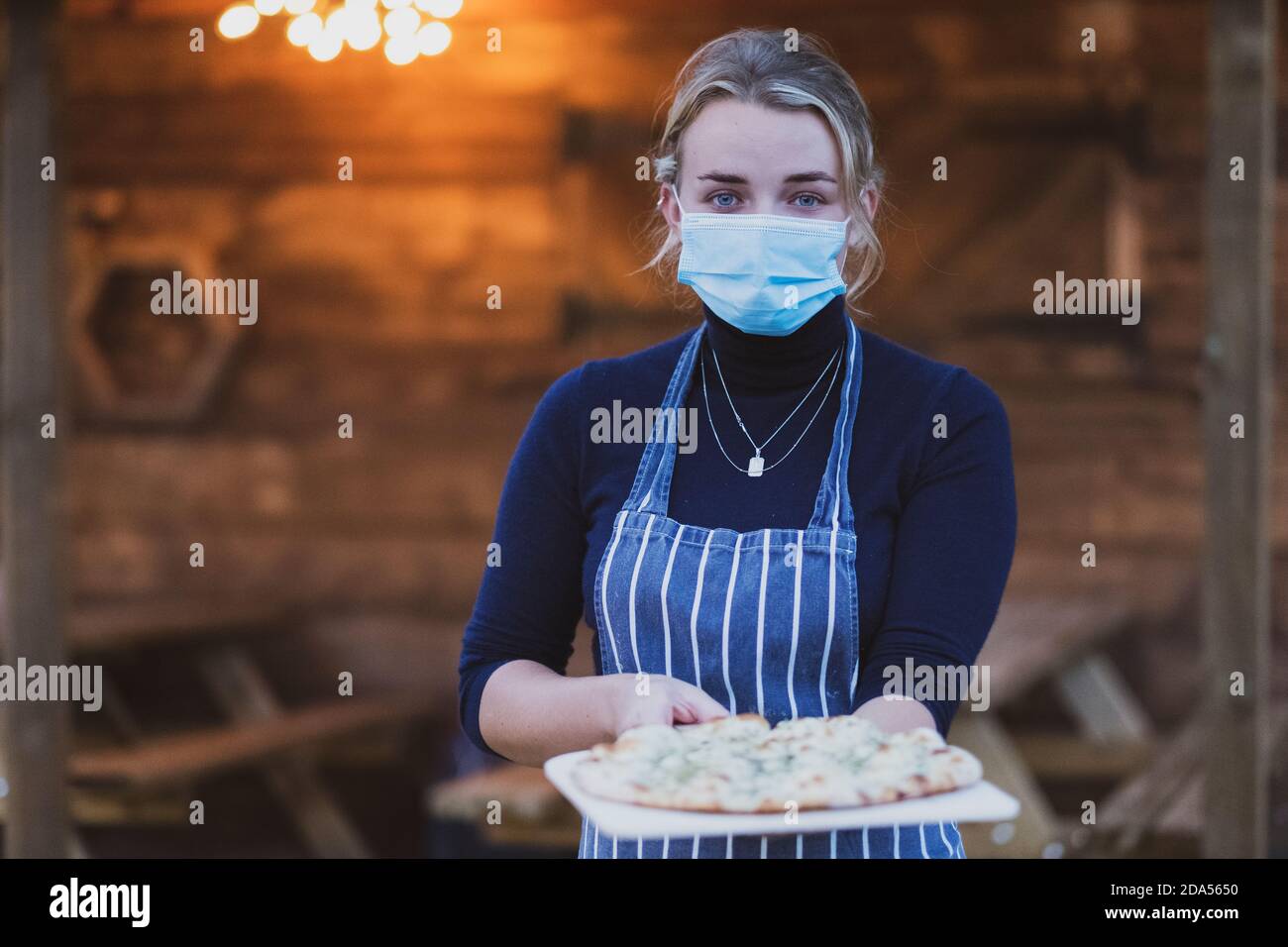 Female with ponytail and mask hi-res stock photography and images - Alamy
