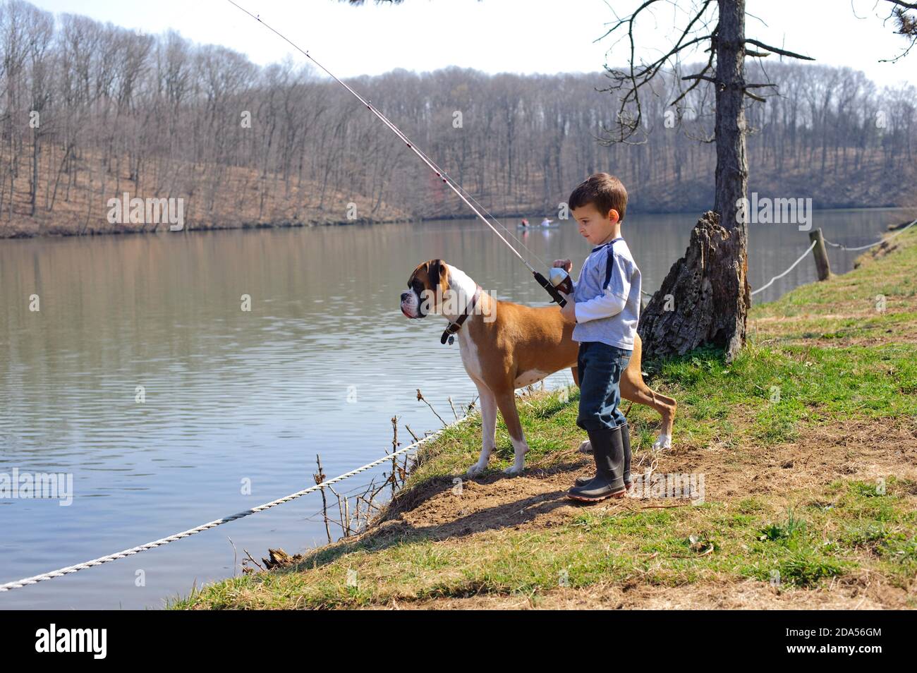 YOUNG BOY WITH HIS DOG FISHING AT SPEEDWELL FORGE LAKE, LANCASTER ...