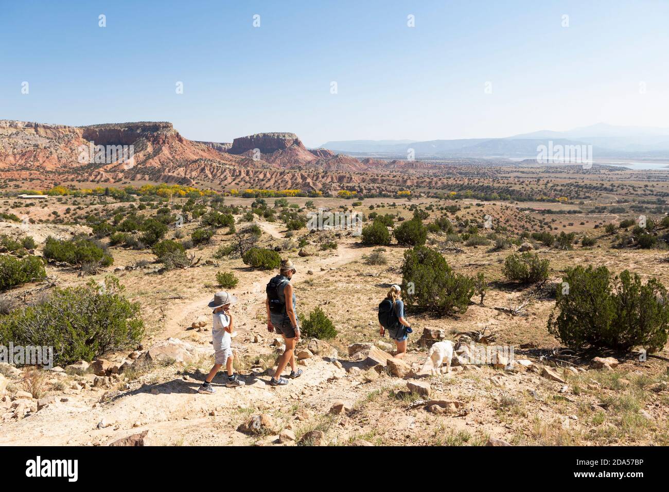 Family of three hiking on trail hi-res stock photography and images - Alamy