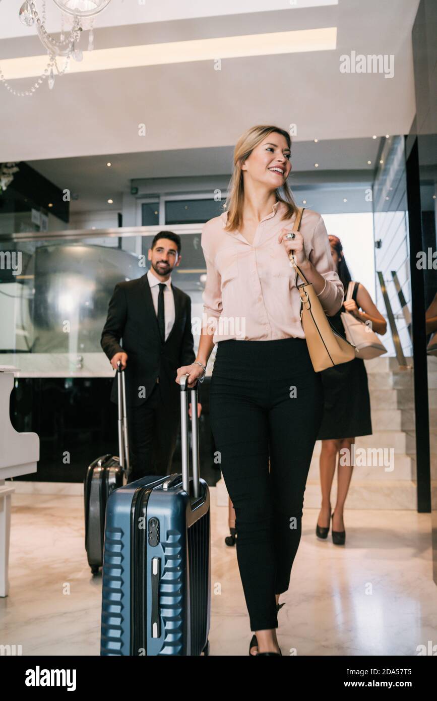 Business people arriving at hotel Stock Photo - Alamy