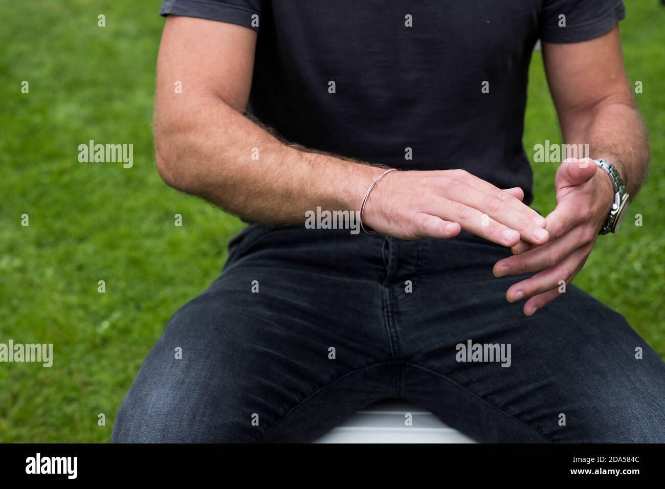 Man using the fingertips of one hand to touch the other hand, EFT ...