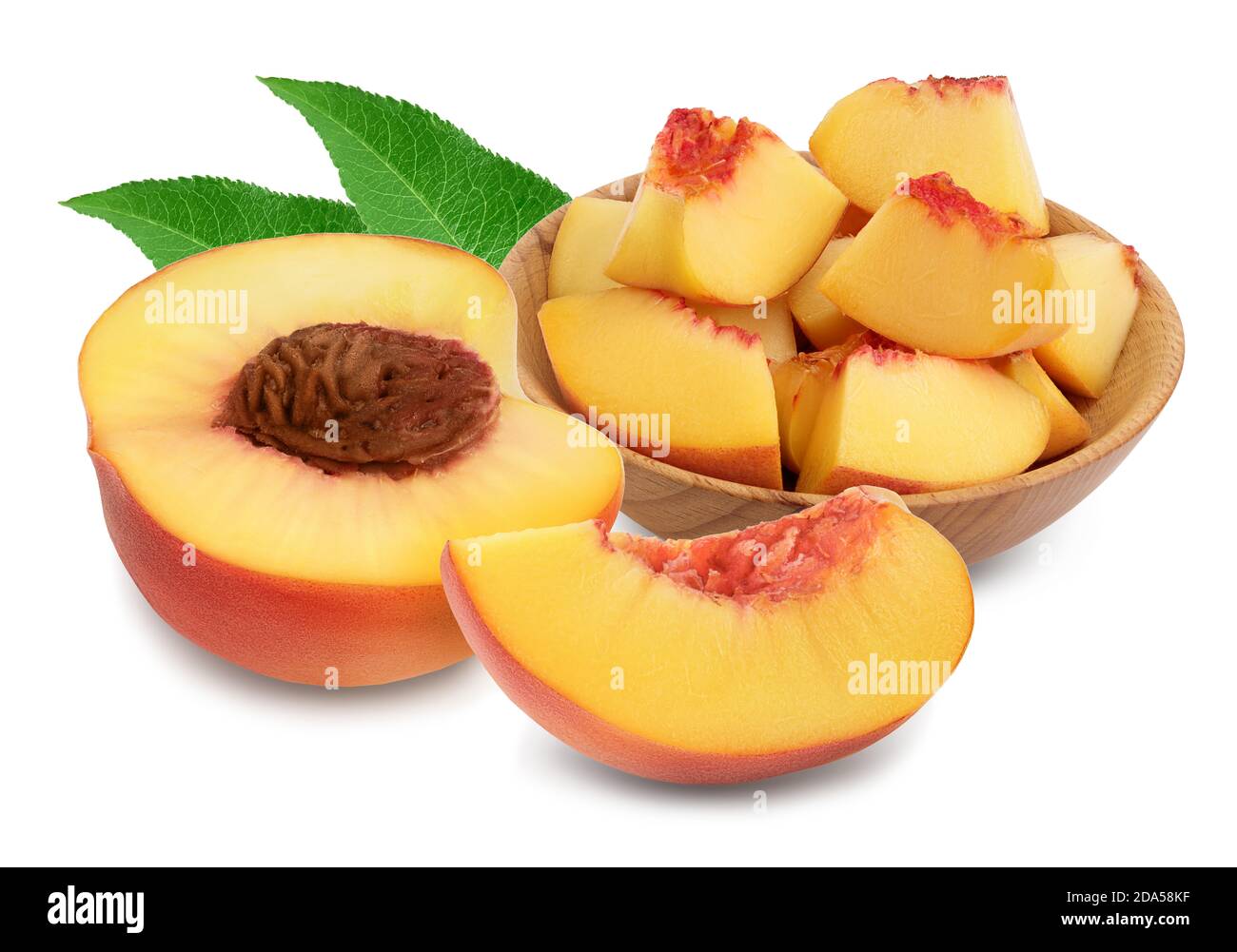 Ripe peach fruit slices in wooden bowl isolated on white background ...