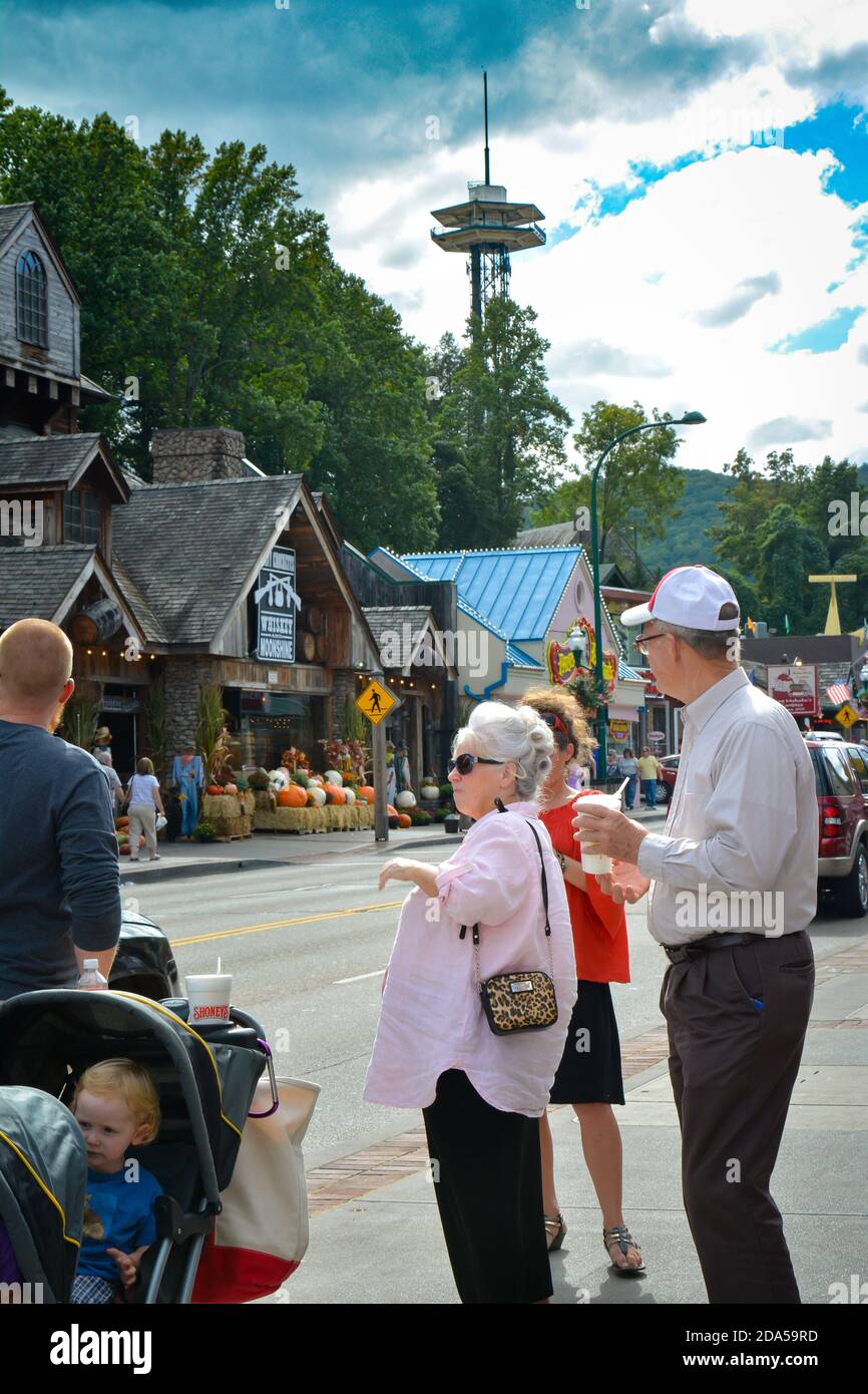 Groups and families stroll the sidewalks of Gatlinburg, TN, for ...