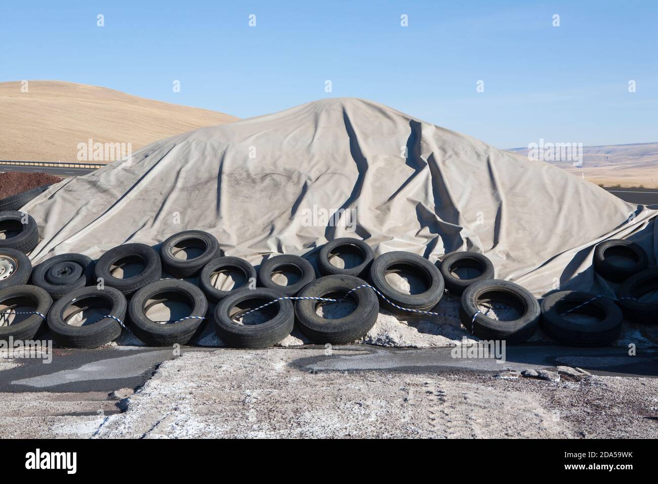 Heap waste covered tarpaulin hi-res stock photography and images - Alamy