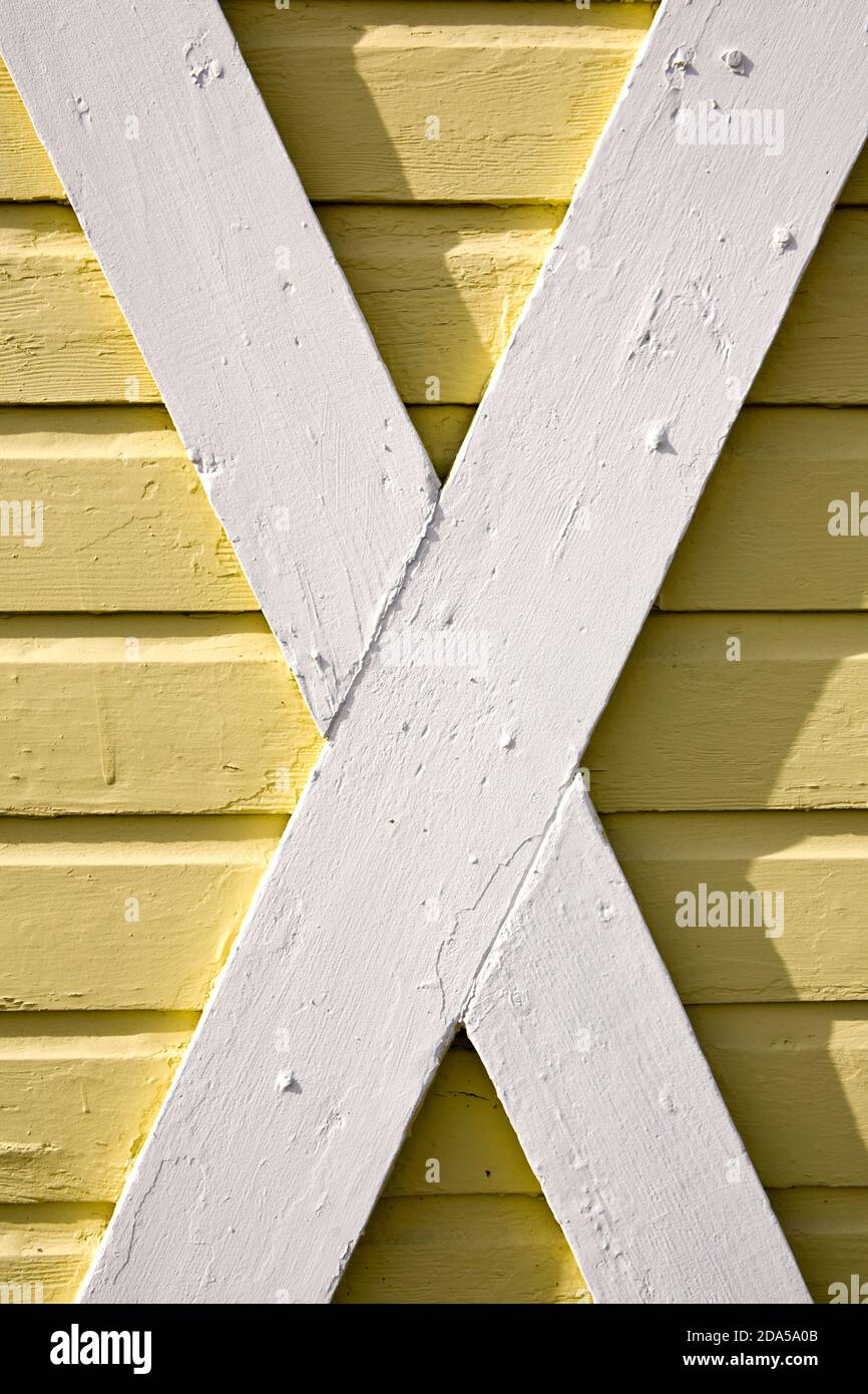 Building exterior, wood cladding, cross beams, white and yellow ...