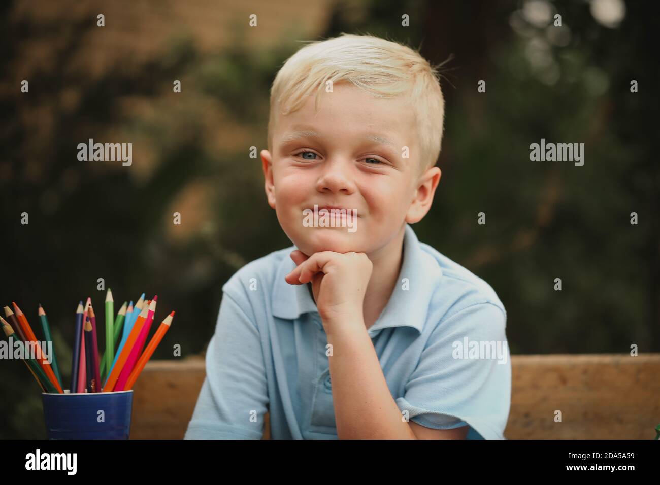 Excited blonde schoolboy - ready for school Stock Photo - Alamy