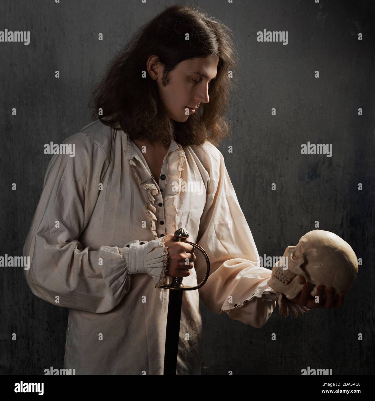 A romantic young man in a medieval costume with a sword says a ...